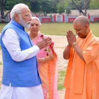 Narendra Modi in Banaras: BJP CM Yogi Adityanath welcomes PM with Red ...